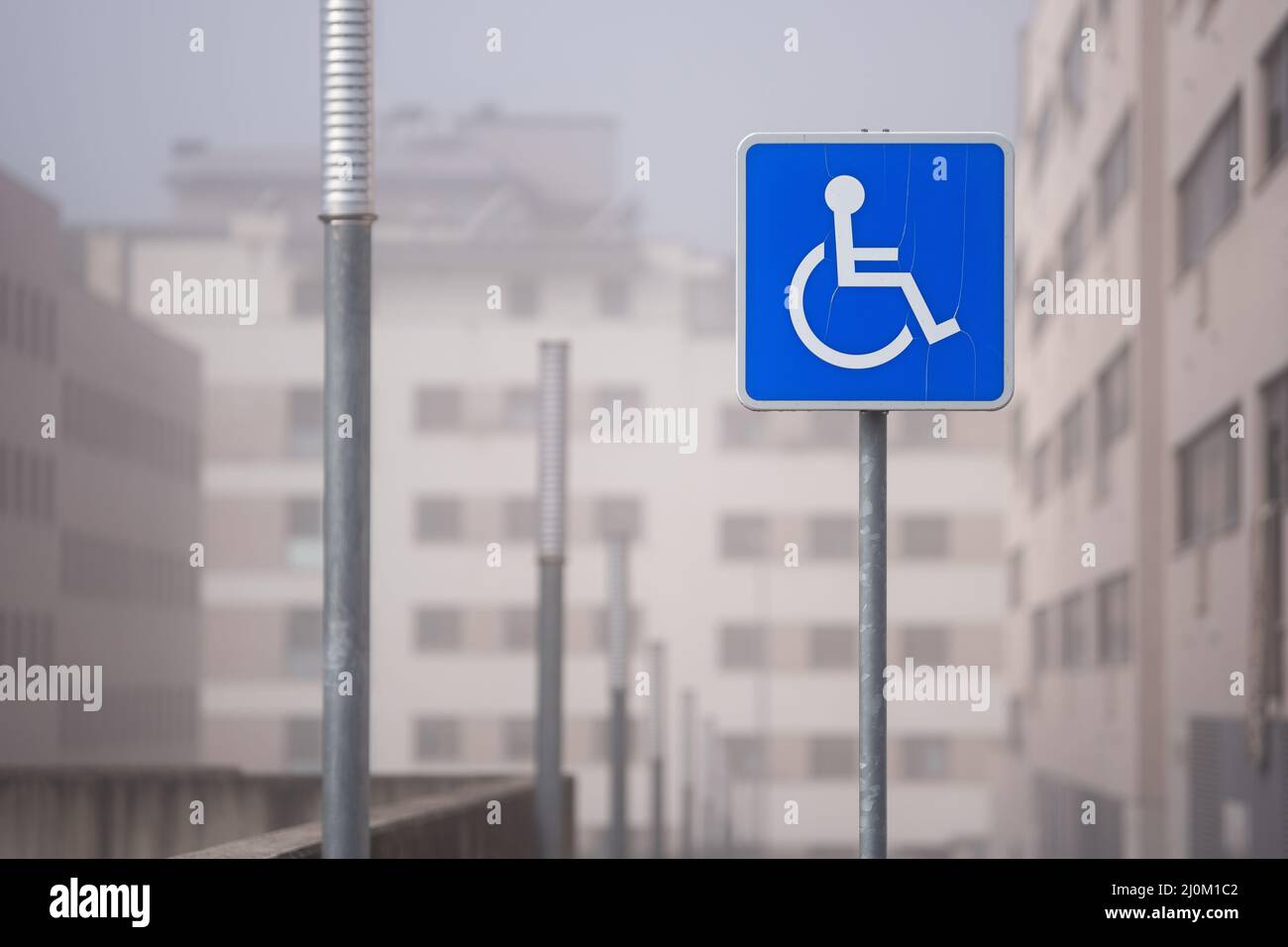 Metal square blue disabled parking sign Stock Photo - Alamy
