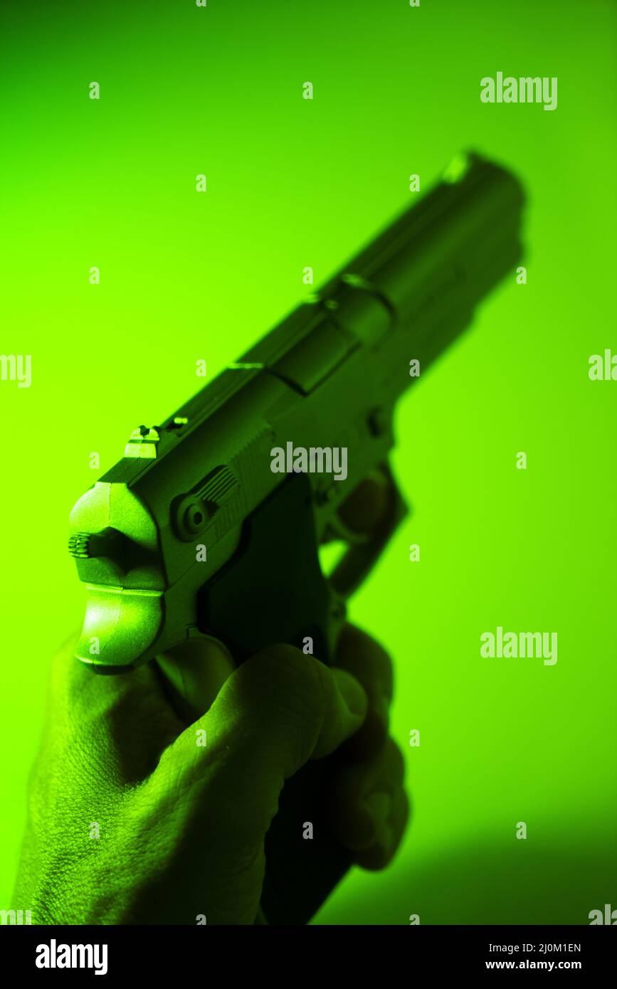 Man shooting pistol gun Stock Photo - Alamy