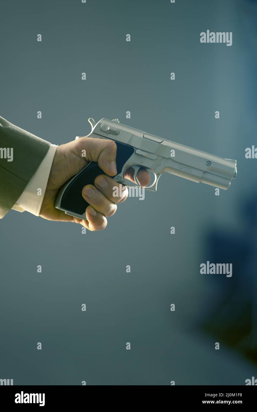 Detective spy killer gun Stock Photo - Alamy