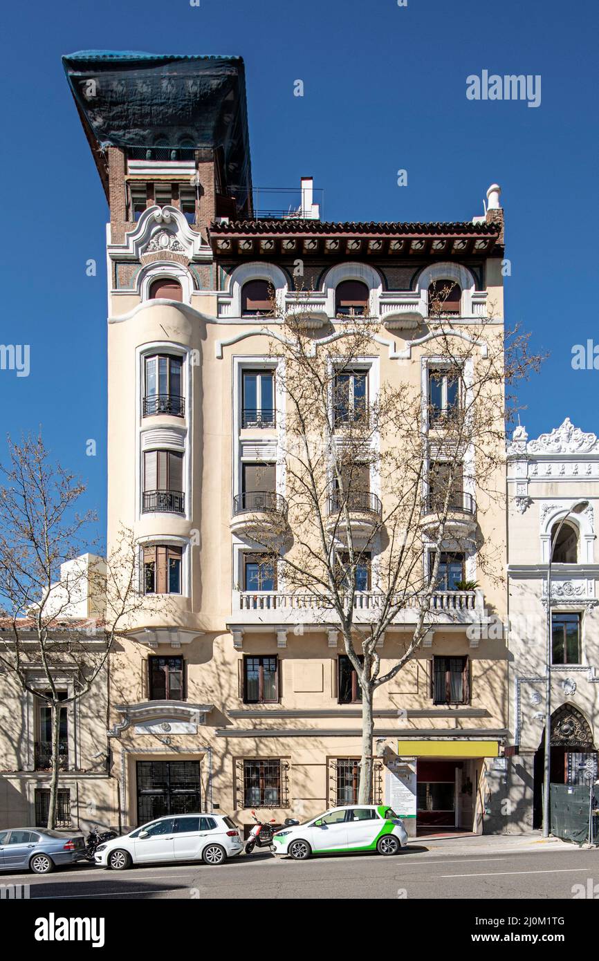 Facade of a solitary seven storey vintage building with balustrades and ...