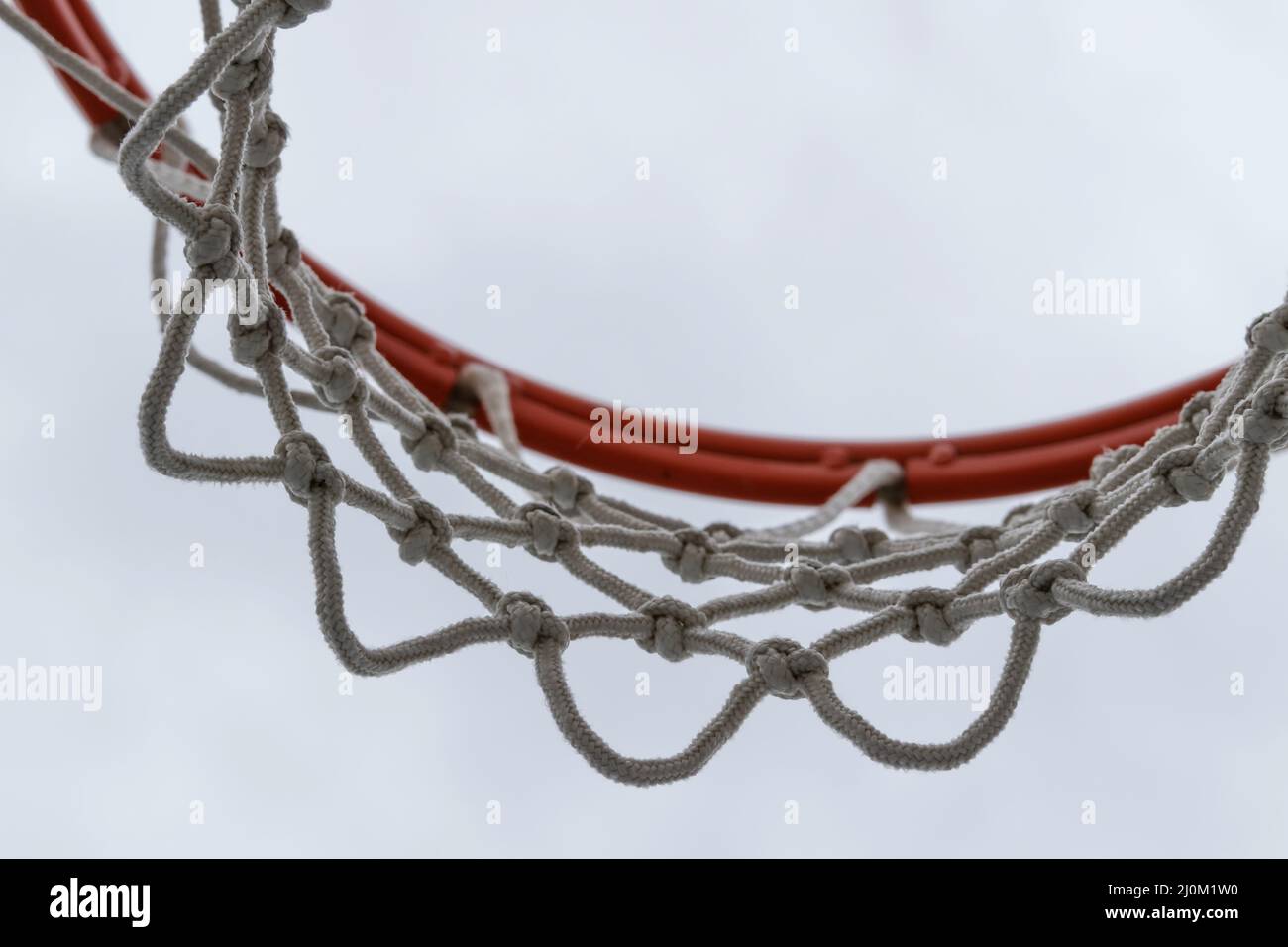 Low angle of a basketball hoop under the gray sky Stock Photo - Alamy