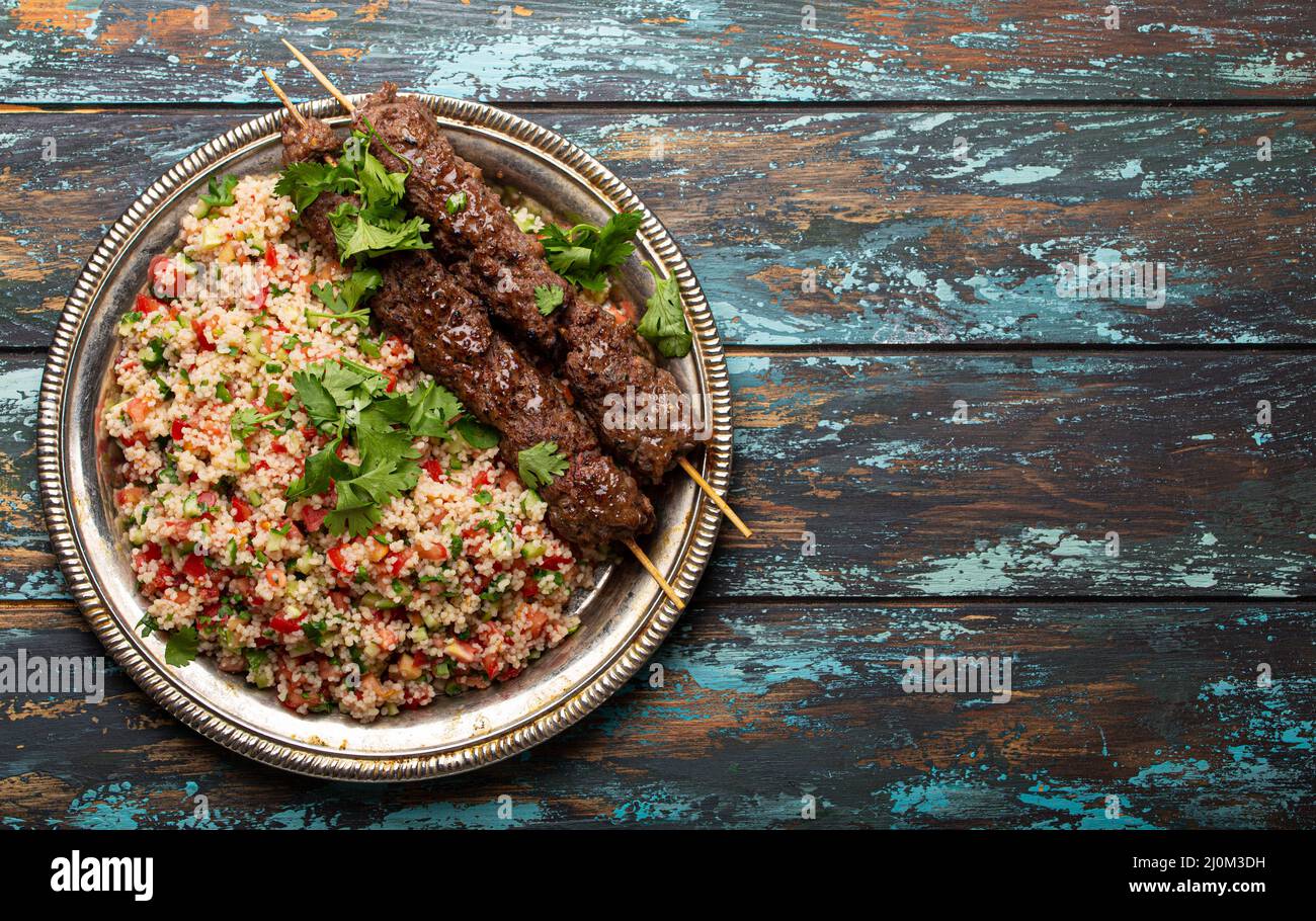 Arab Turkish kebab with tabbouleh salad Stock Photo - Alamy