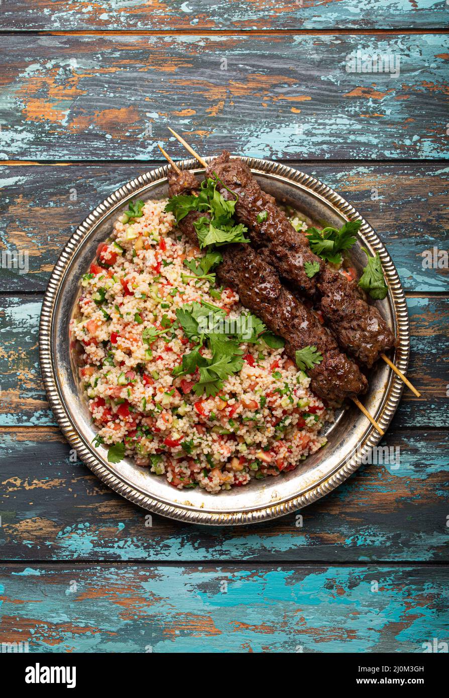 Arab Turkish kebab with tabbouleh salad Stock Photo - Alamy
