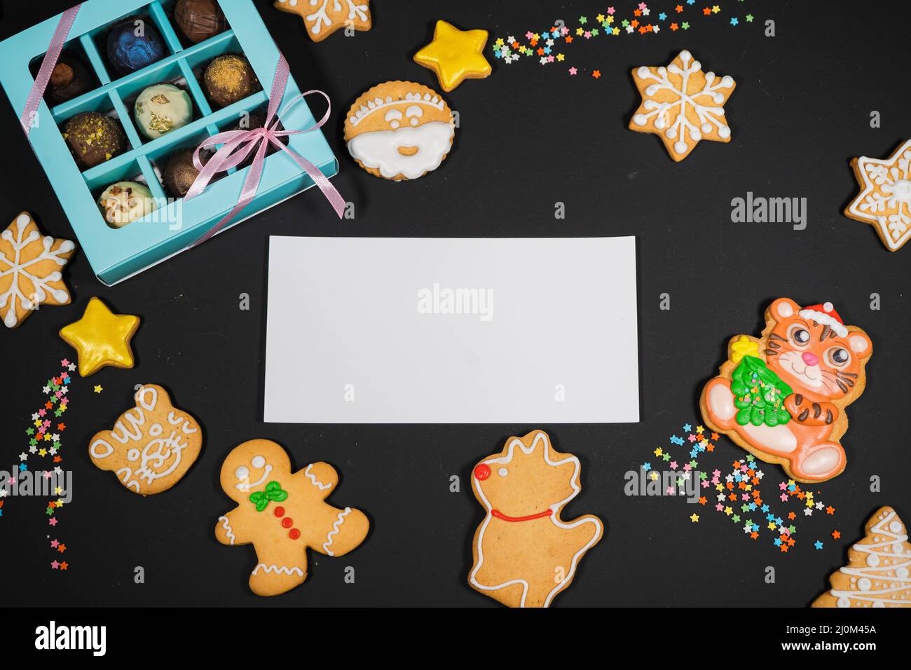 Christmas background with gingerbread on gray surface. Holiday mood ...