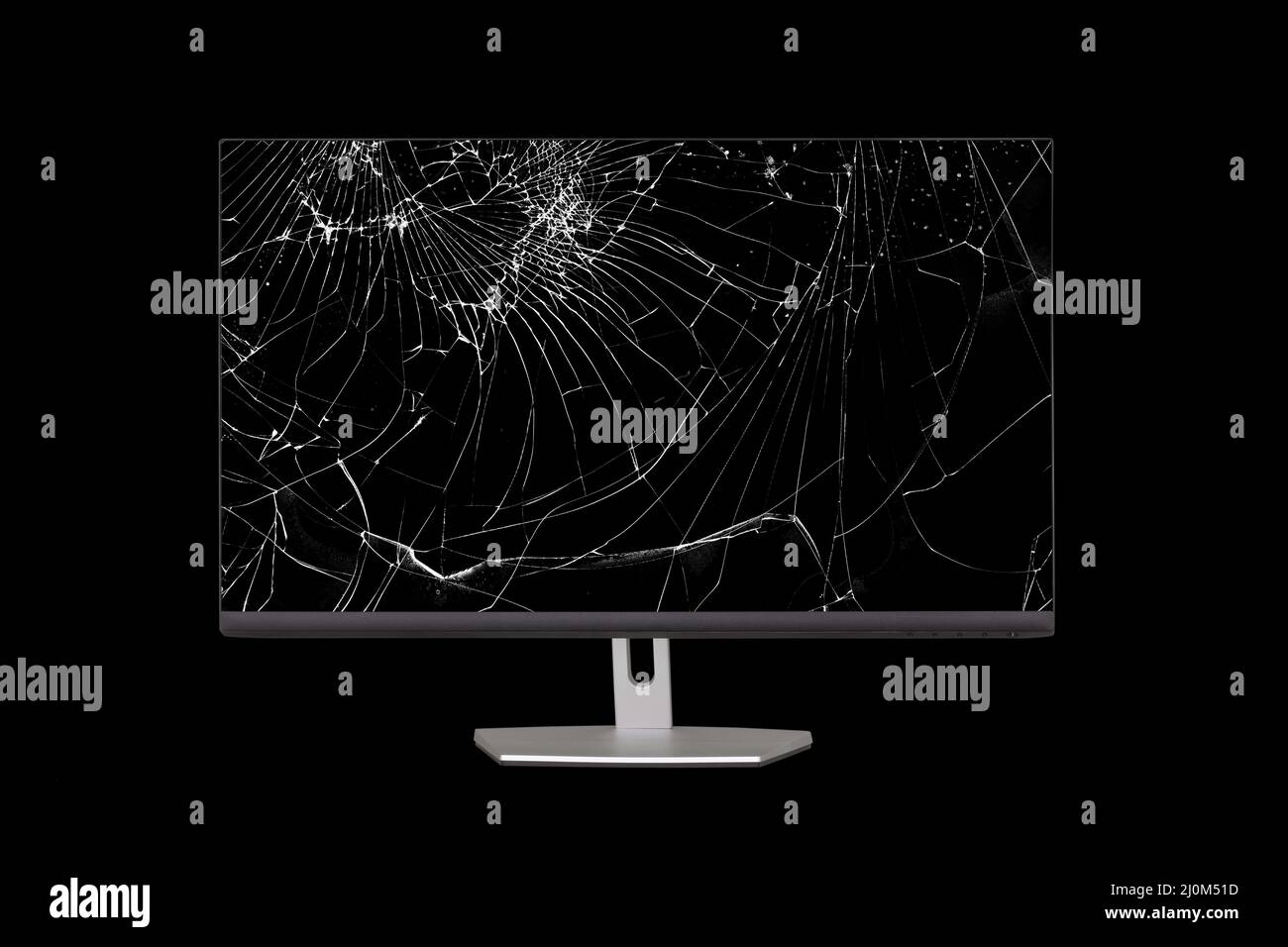 Computer monitor with a broken screen isolated on a black background ...