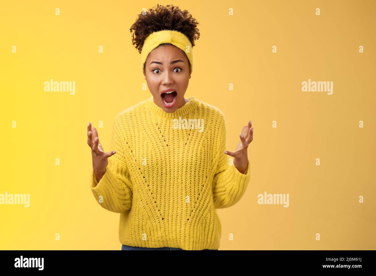 Shocked stunned african-american disappointed woman cannot believe ...
