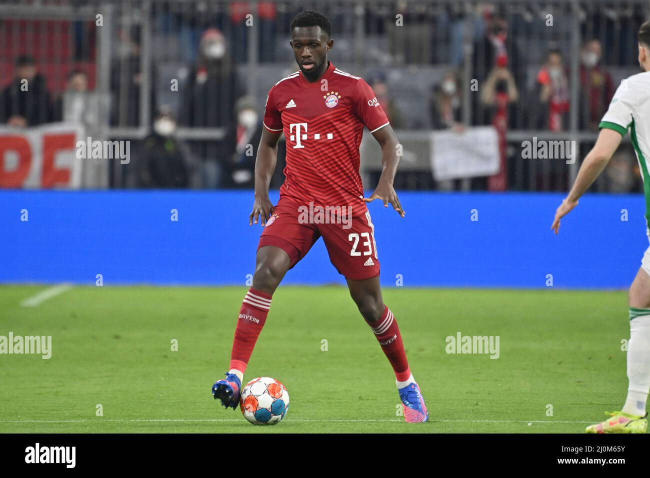 Munich, Deutschland. 19th Mar, 2022. Tanguy Nianzou Kouassi (Bayern Munich). Action, single ...