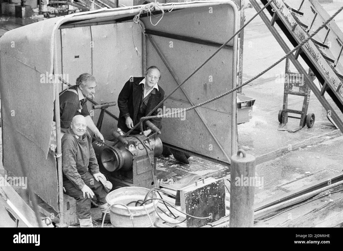 Crewmen of the Trawler Marbi Larde seen here operating a winch to ...