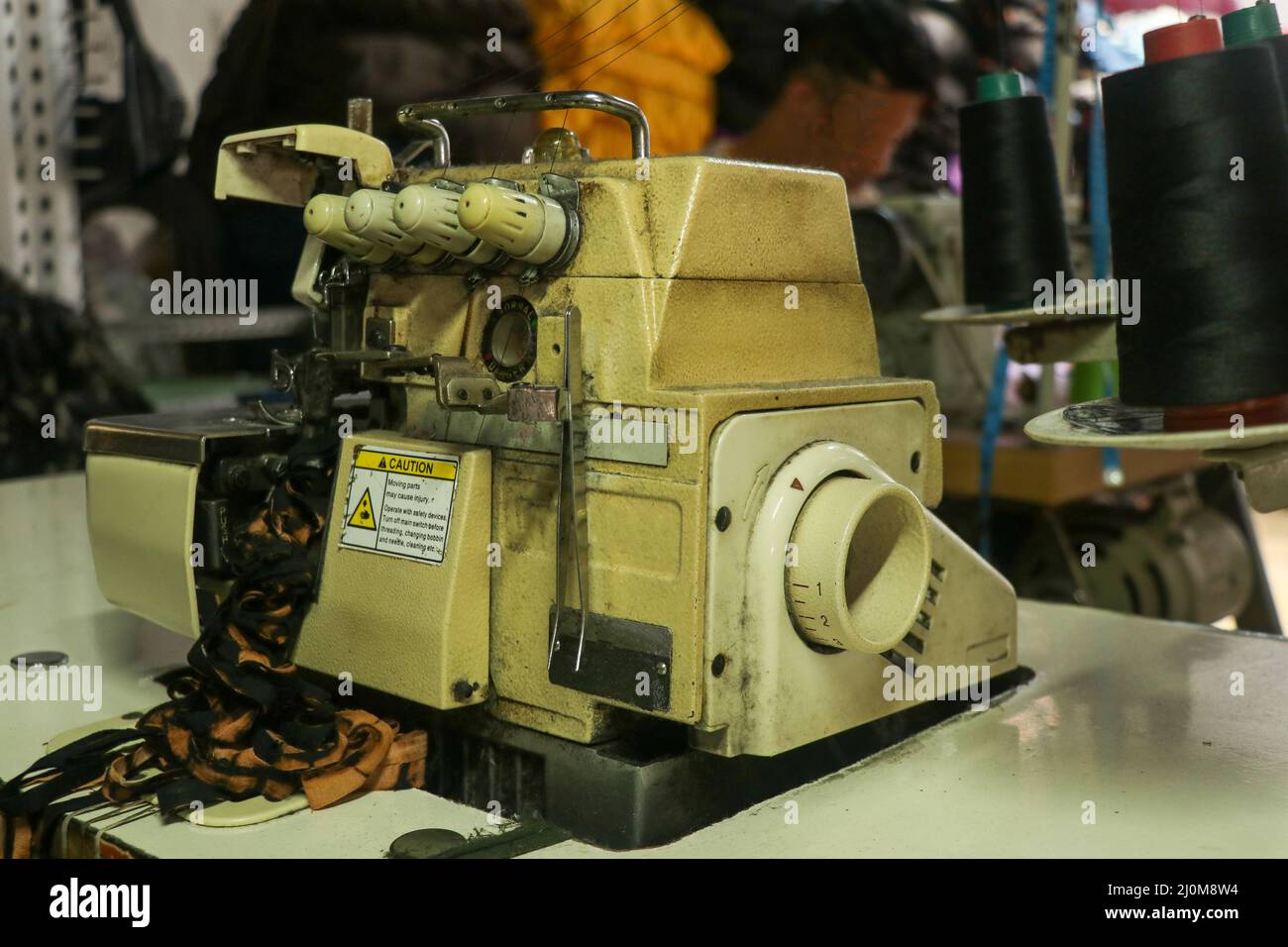 overlock close-up. sewing clothes at the enterprise. Industrial sewing ...