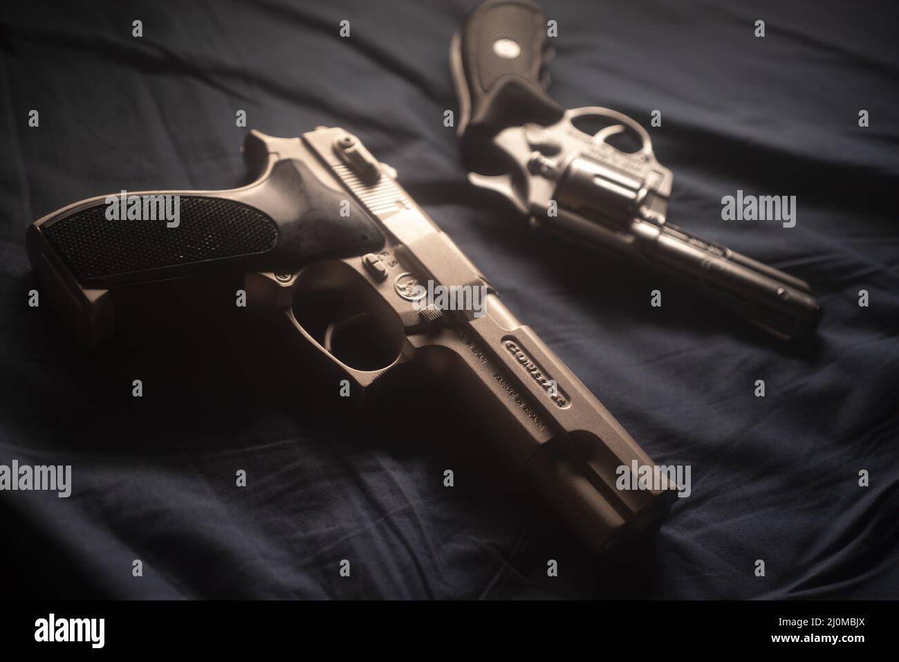 Pistol an bed hi-res stock photography and images - Alamy