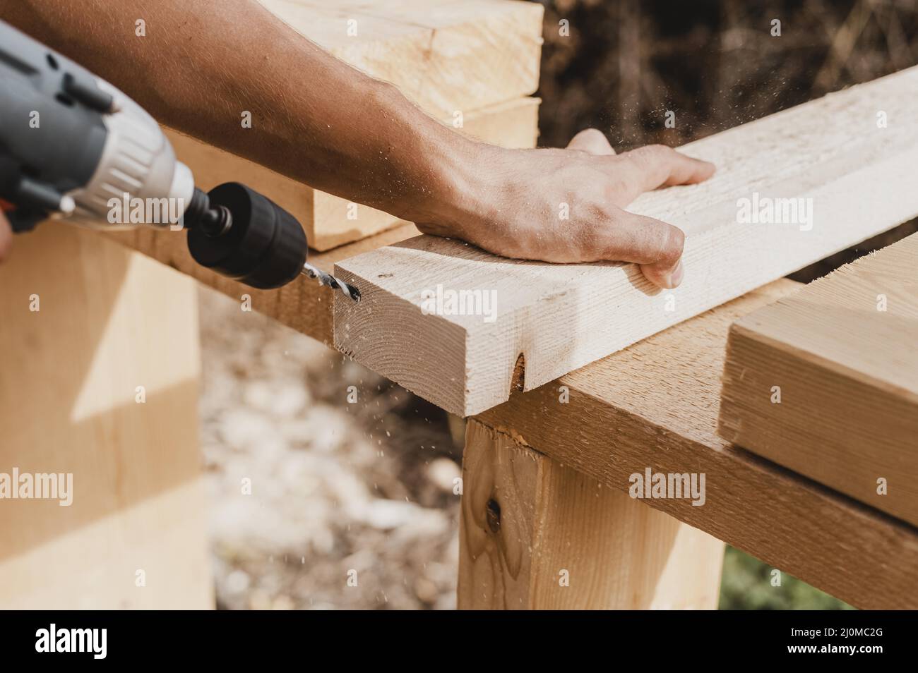 High view person holding hammer drill Stock Photo - Alamy