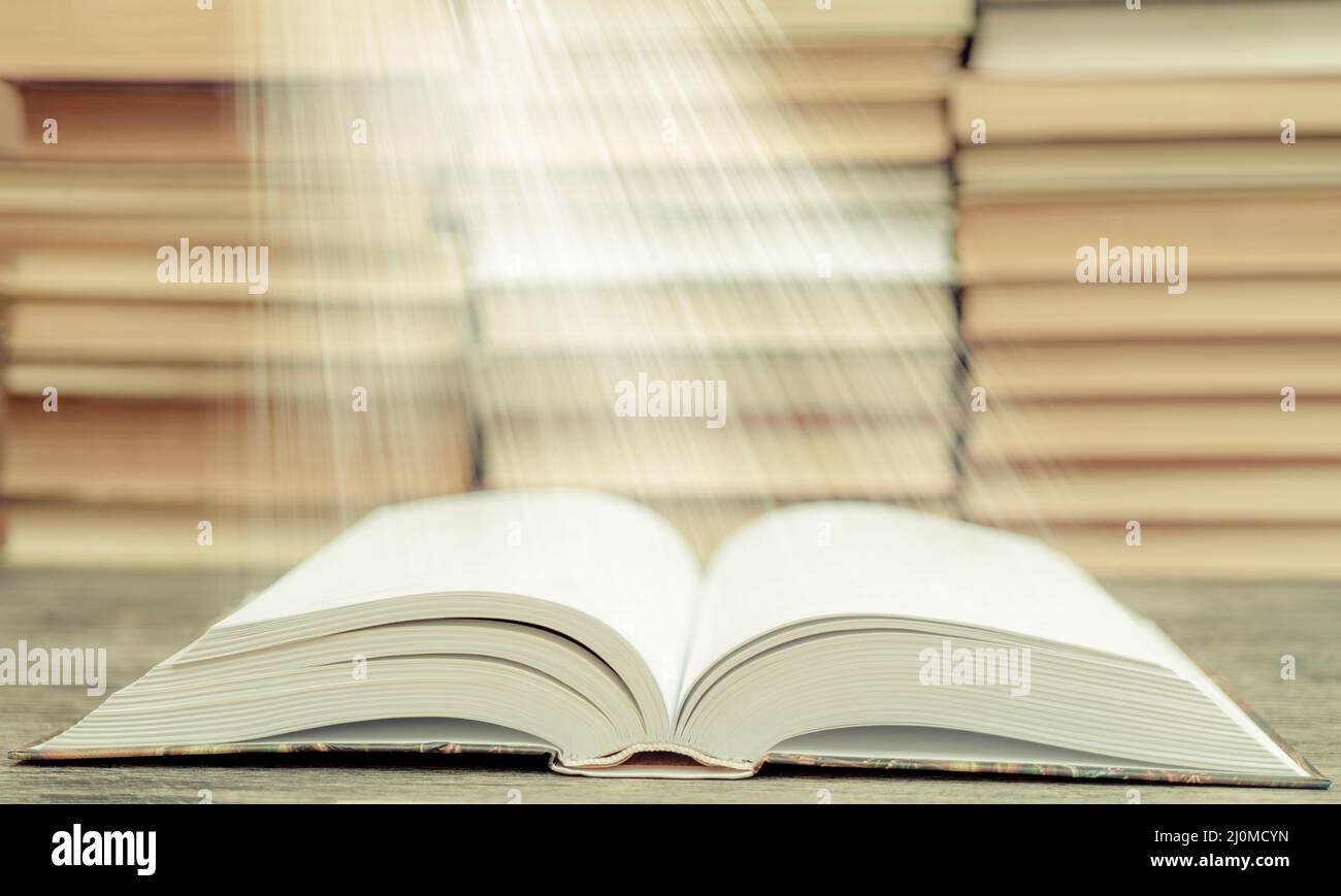 Book pages emit light. Symbol of wisdom, knowledge and learning Stock ...