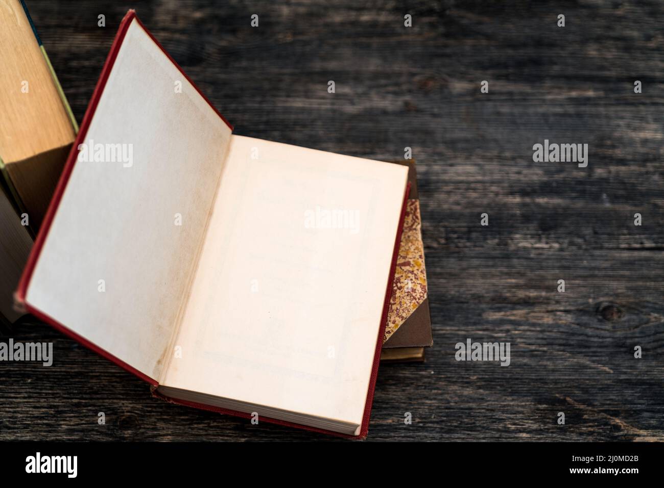 Thick paper books are a symbol of education and wisdom. A stack of ...