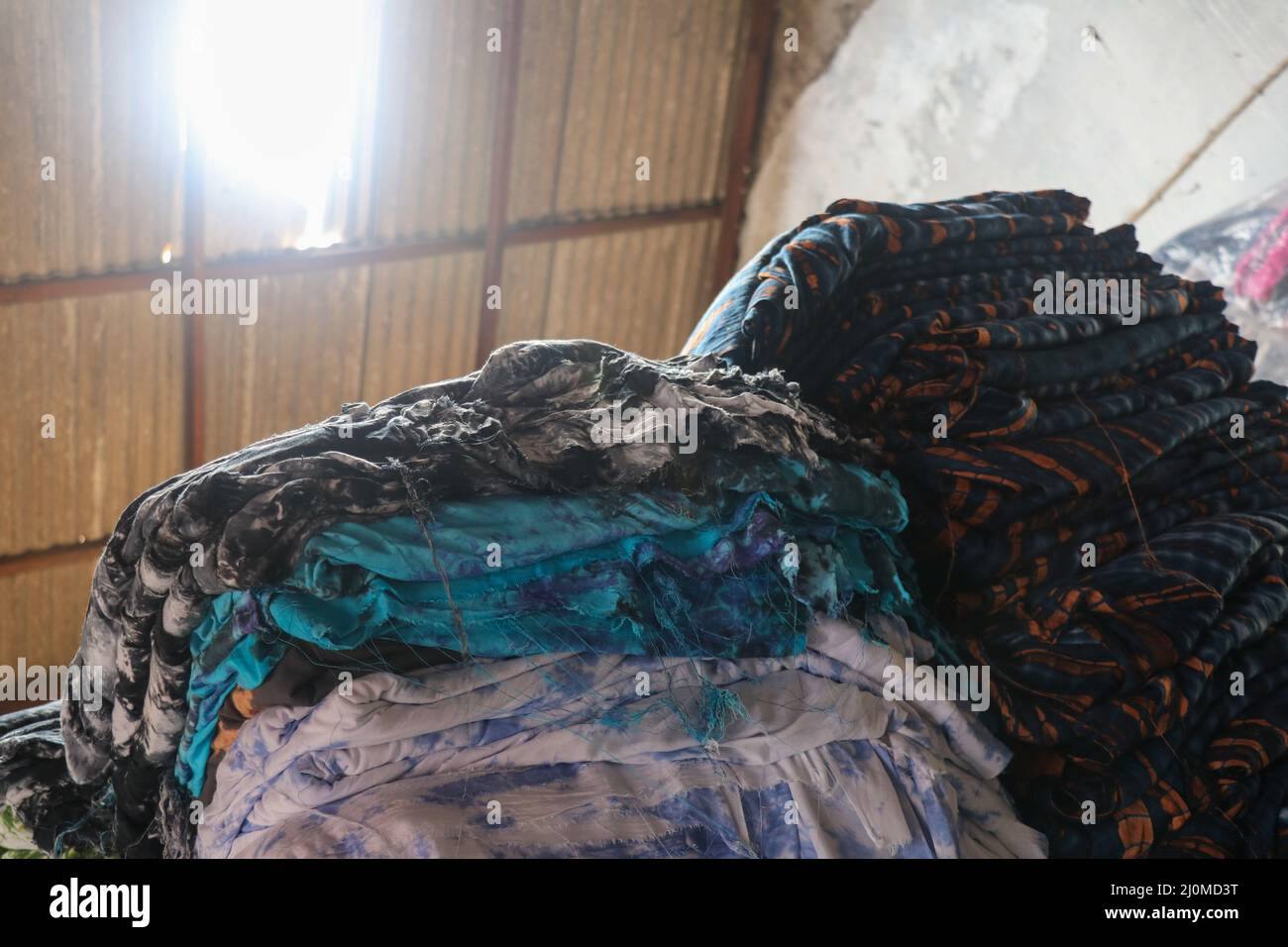 Colorful pile of batik fabrics or textiles. Colored textile in a ...