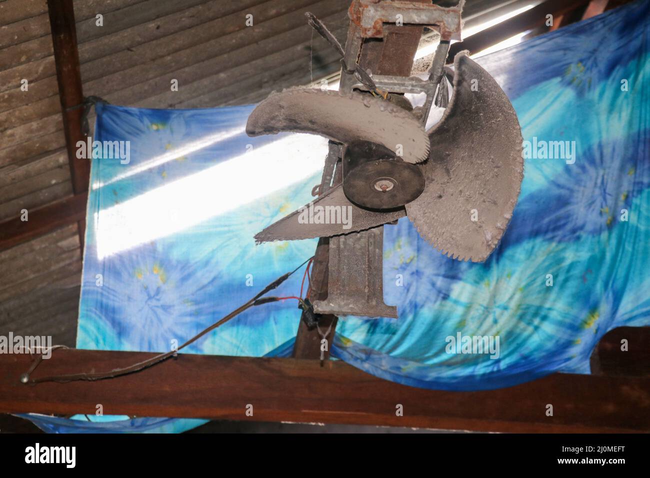 Old ceiling fan hanging under roof, asian style. old electric ceiling ...