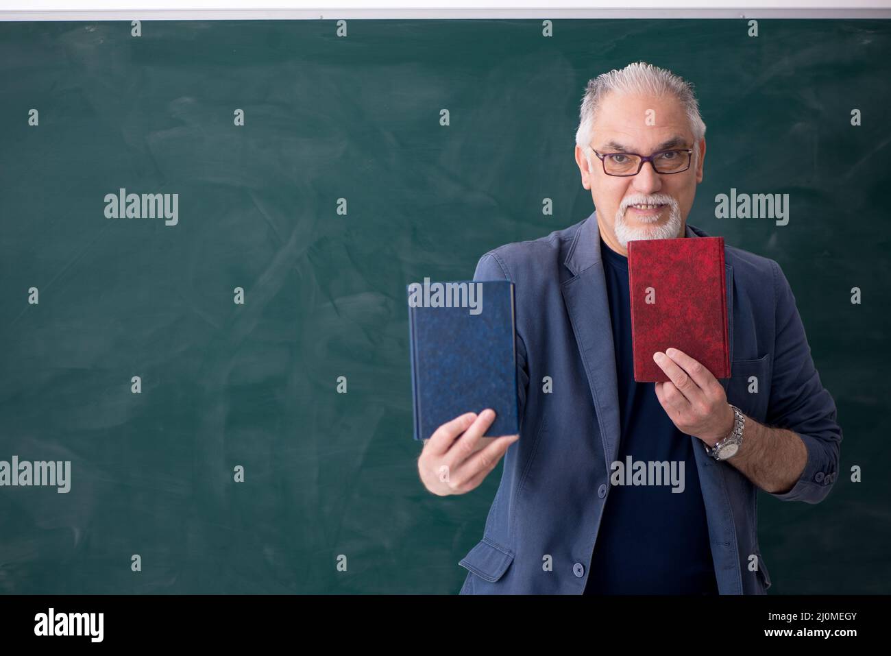 Lecturer holding textbook hi-res stock photography and images - Alamy