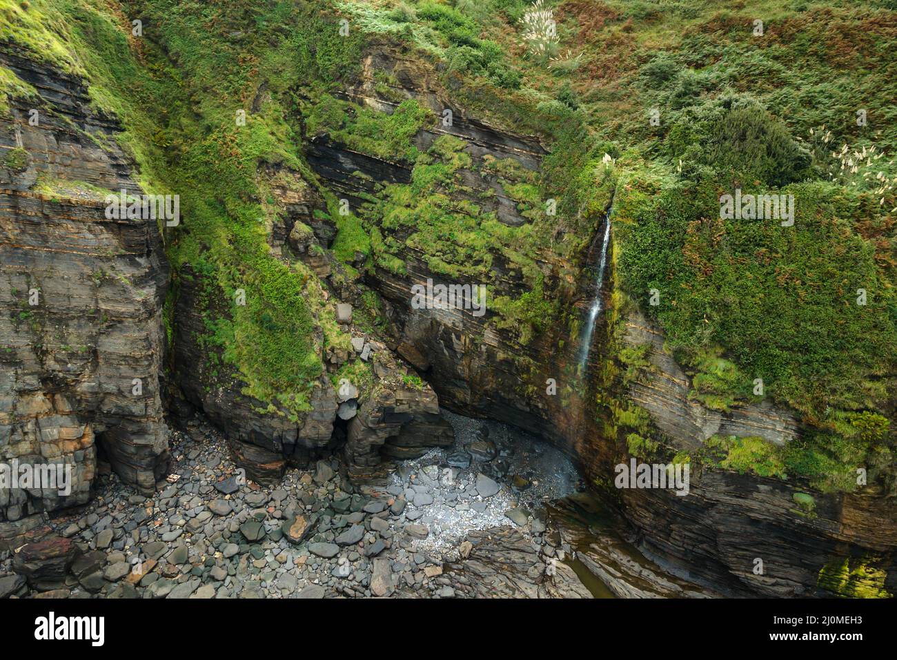 Aerial view of an idyllic waterfall at tropical coastline scenery Stock ...