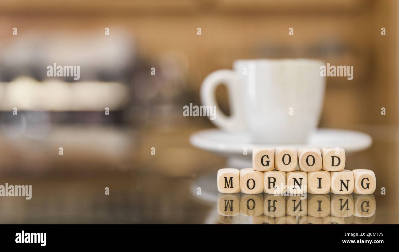 Good morning cubic blocks with cup coffee reflection glass Stock Photo ...