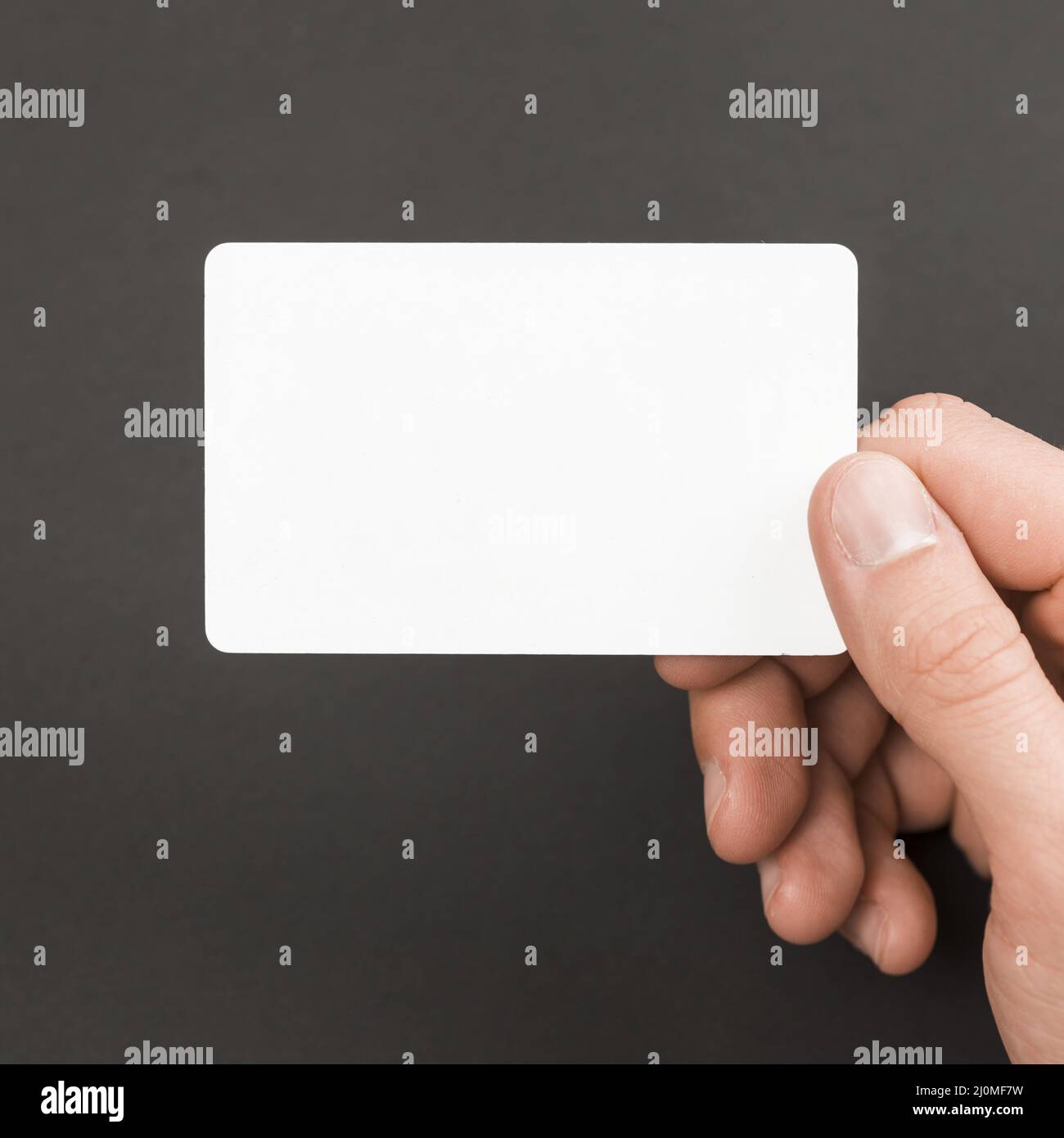 Hand holding business card Stock Photo - Alamy