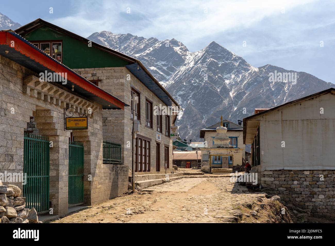 Lukla, Nepal - March 7, 2022: A dirt street in the small town of Lukla ...