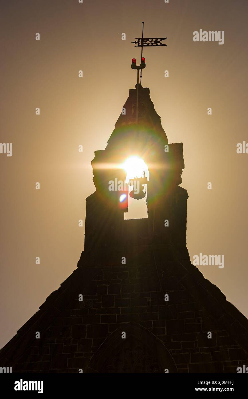 Silhouette of old church in Bulla Victoria with sunset glinting through ...