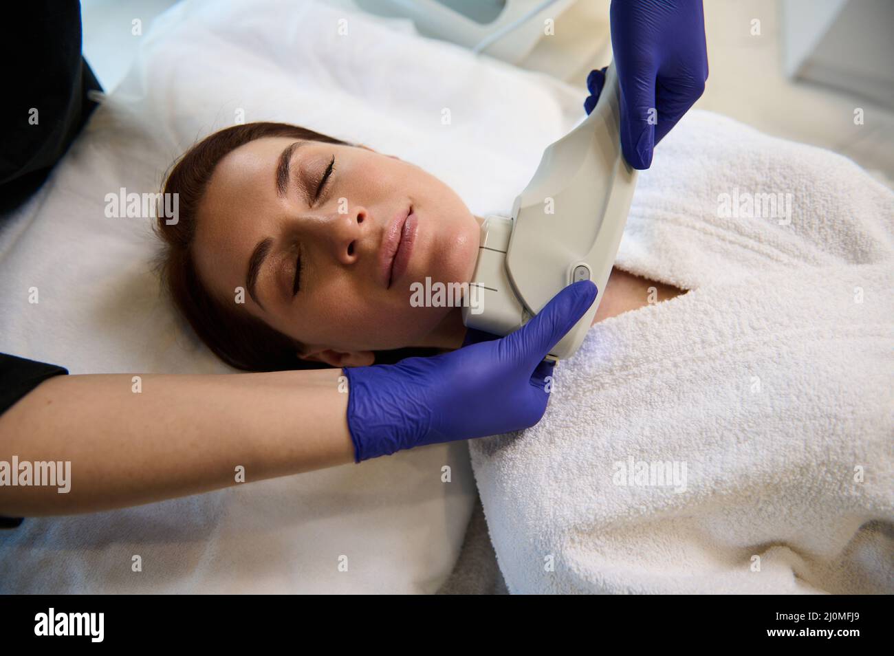 Professional cosmetologist using modern cosmetic hi-res stock ...