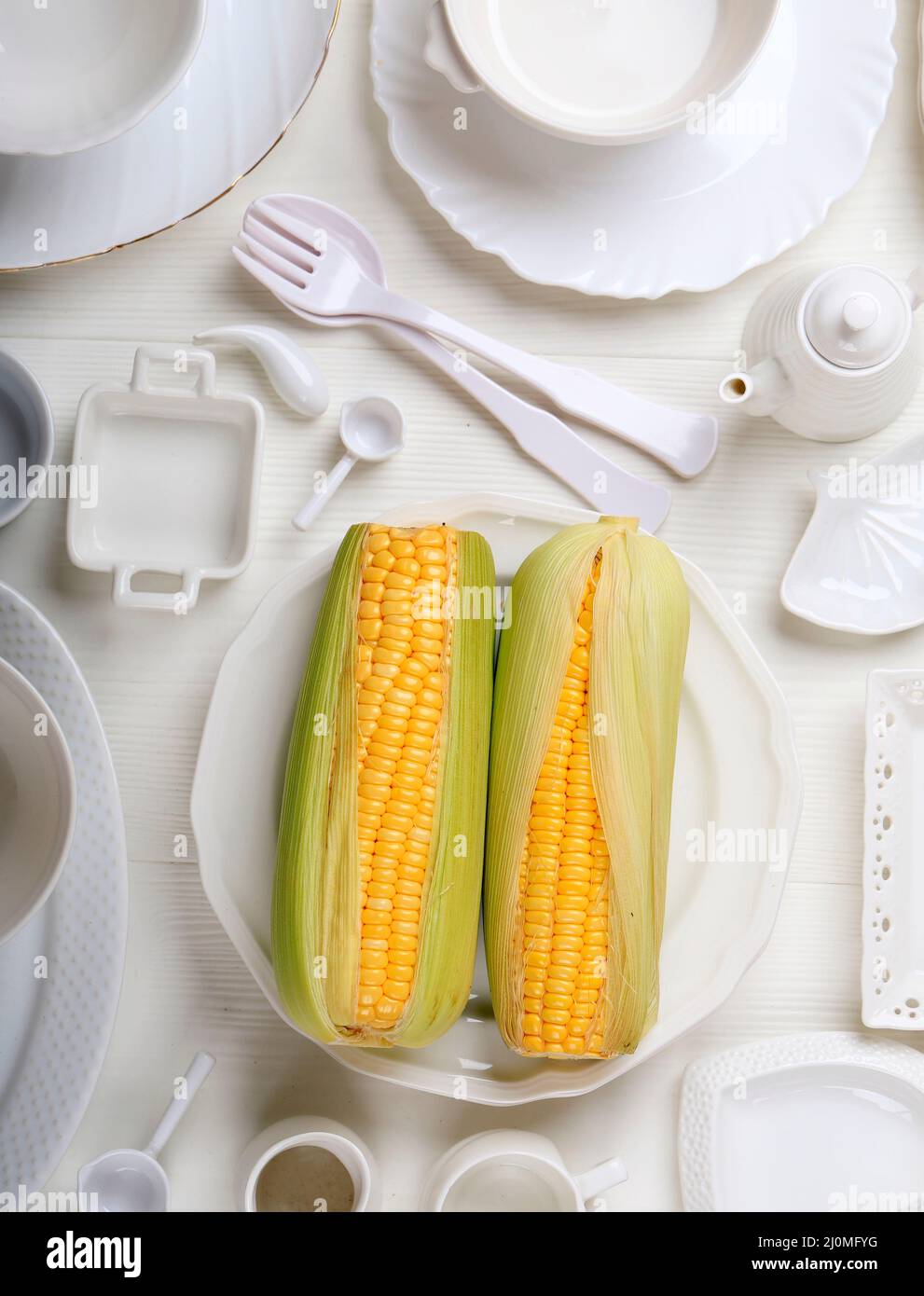Fresh Corn COb on White Plate, Concept for Book Cover or Recipe Book ...