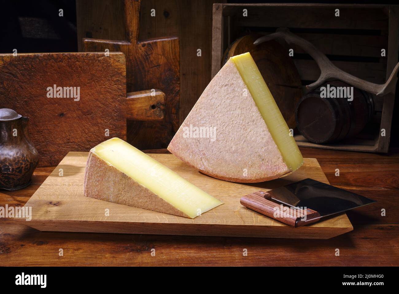 Traditional aged mountain cheese of the Alps offered as loaf and piece ...