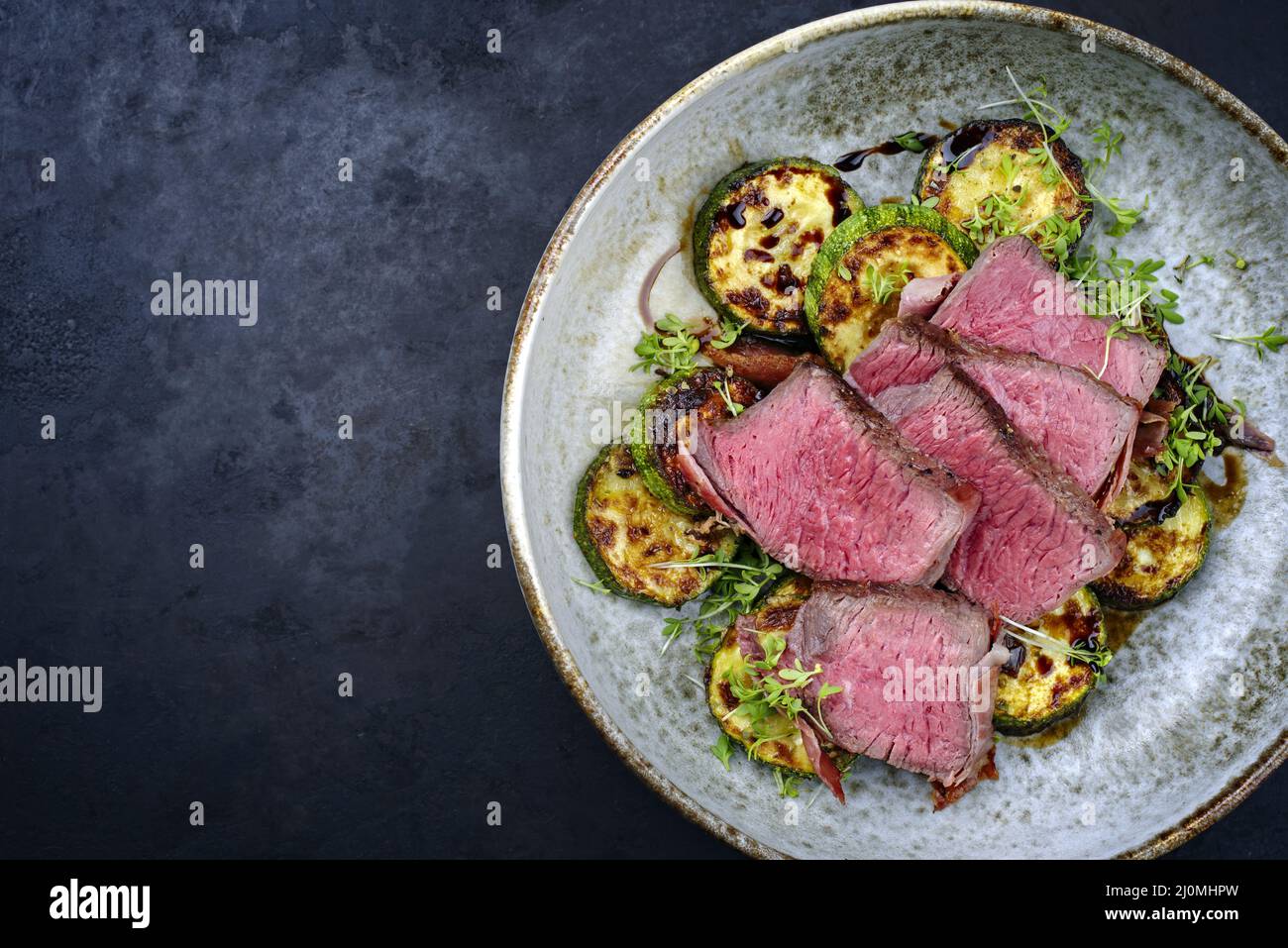 Modern style traditional fried dry aged angus beef filet medaillons ...
