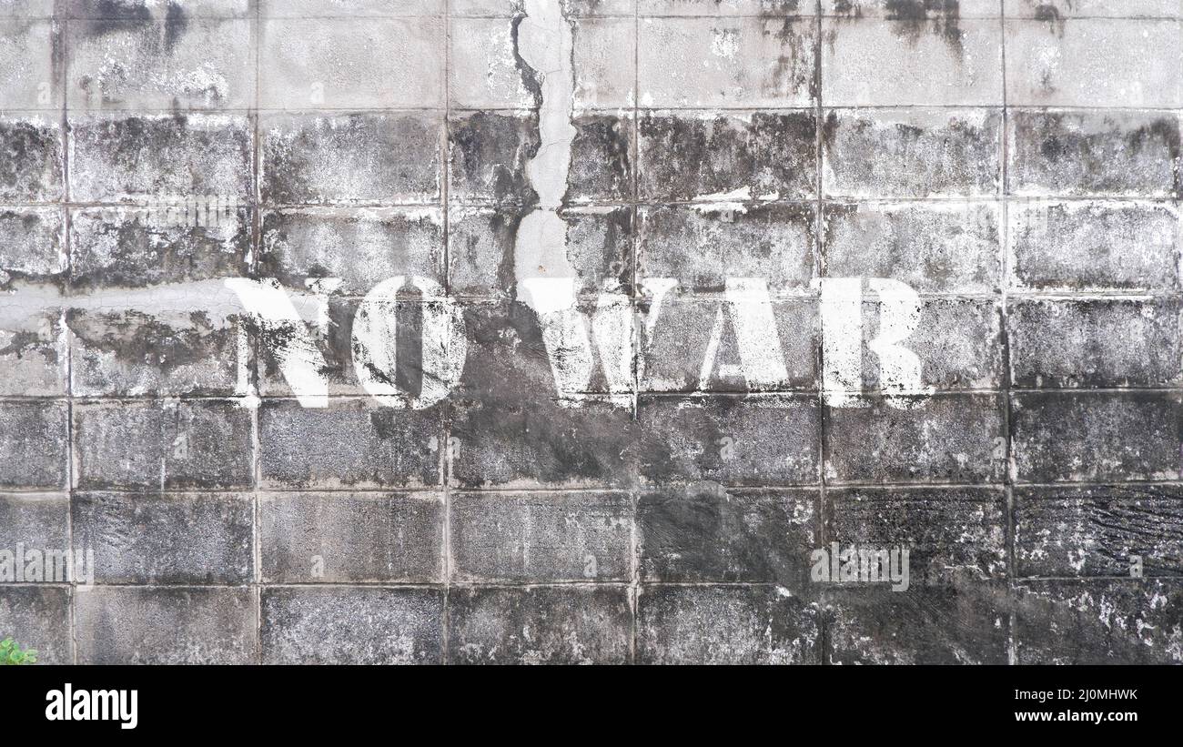 Old concrete wall of a building outdoors with a "No war" writing Stock ...