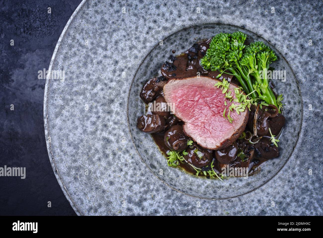 Modern style traditional fried dry aged angus beef filet medaillons ...