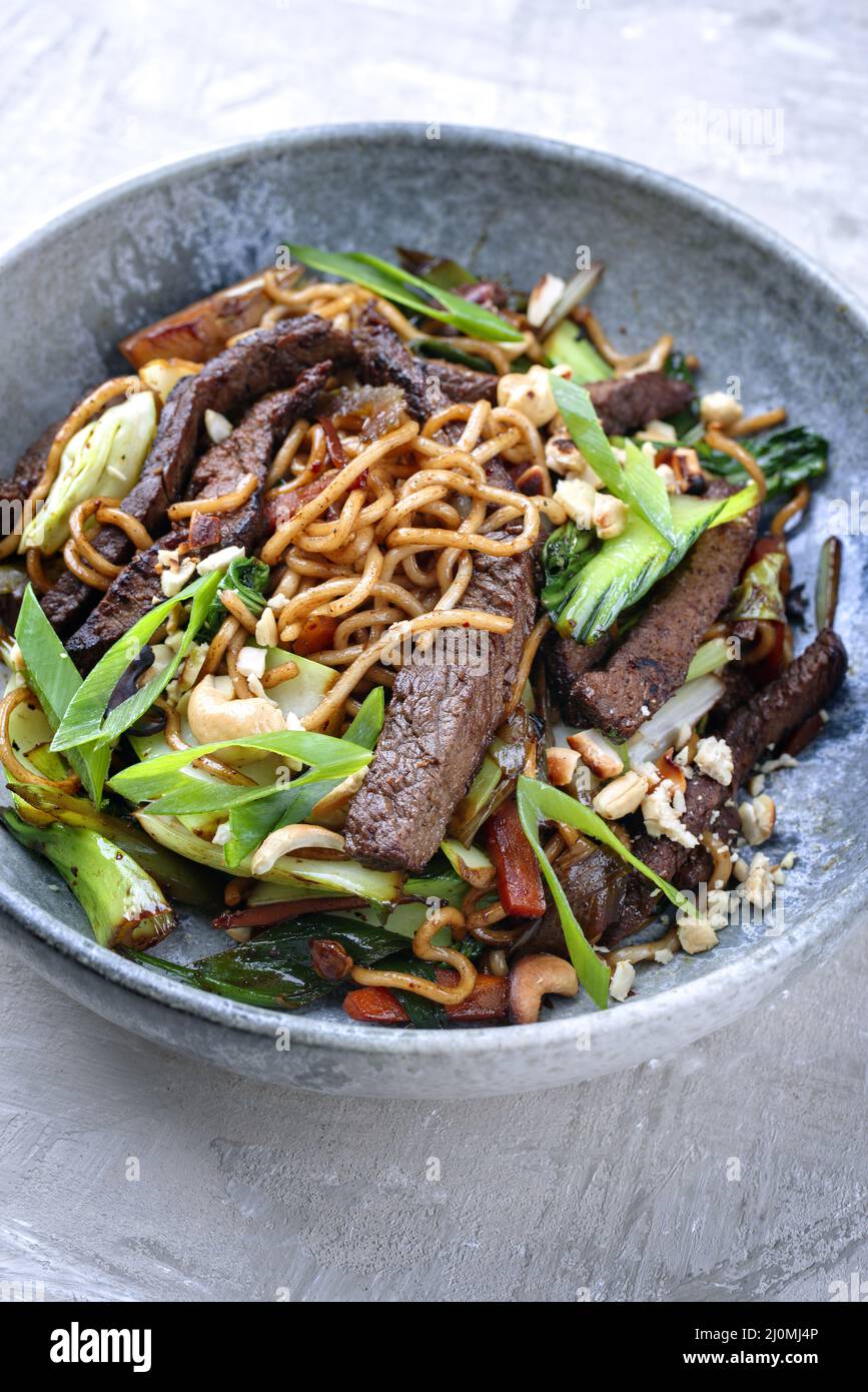 Modern style pad Thai beef with angus roast beef slices Stock Photo - Alamy