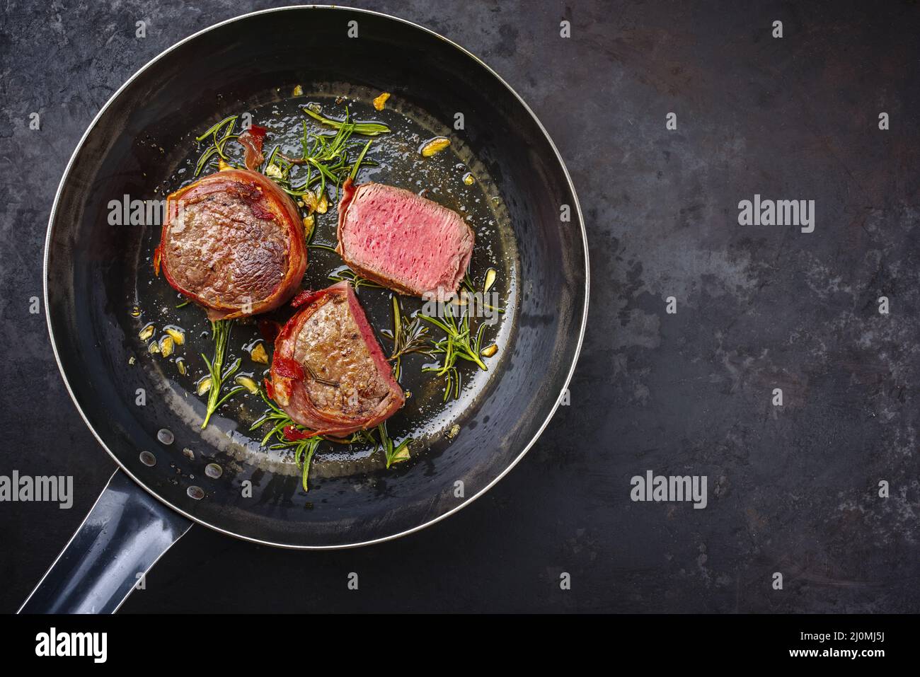 Traditional fried dry aged angus beef filet medaillons natural wrapped ...