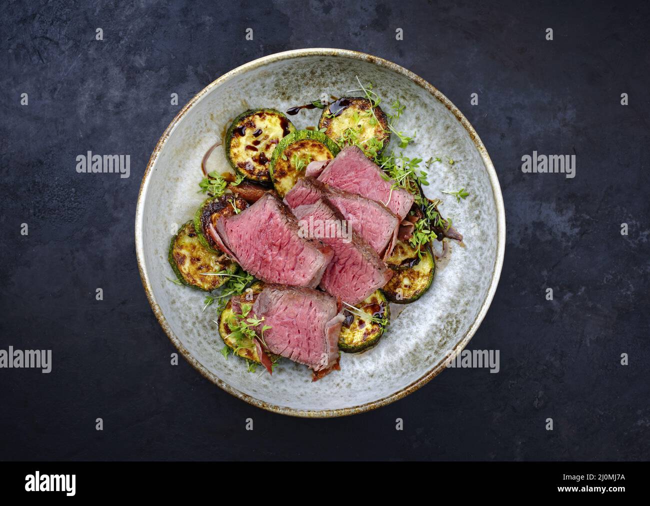 Modern style traditional fried dry aged angus beef filet medaillons ...