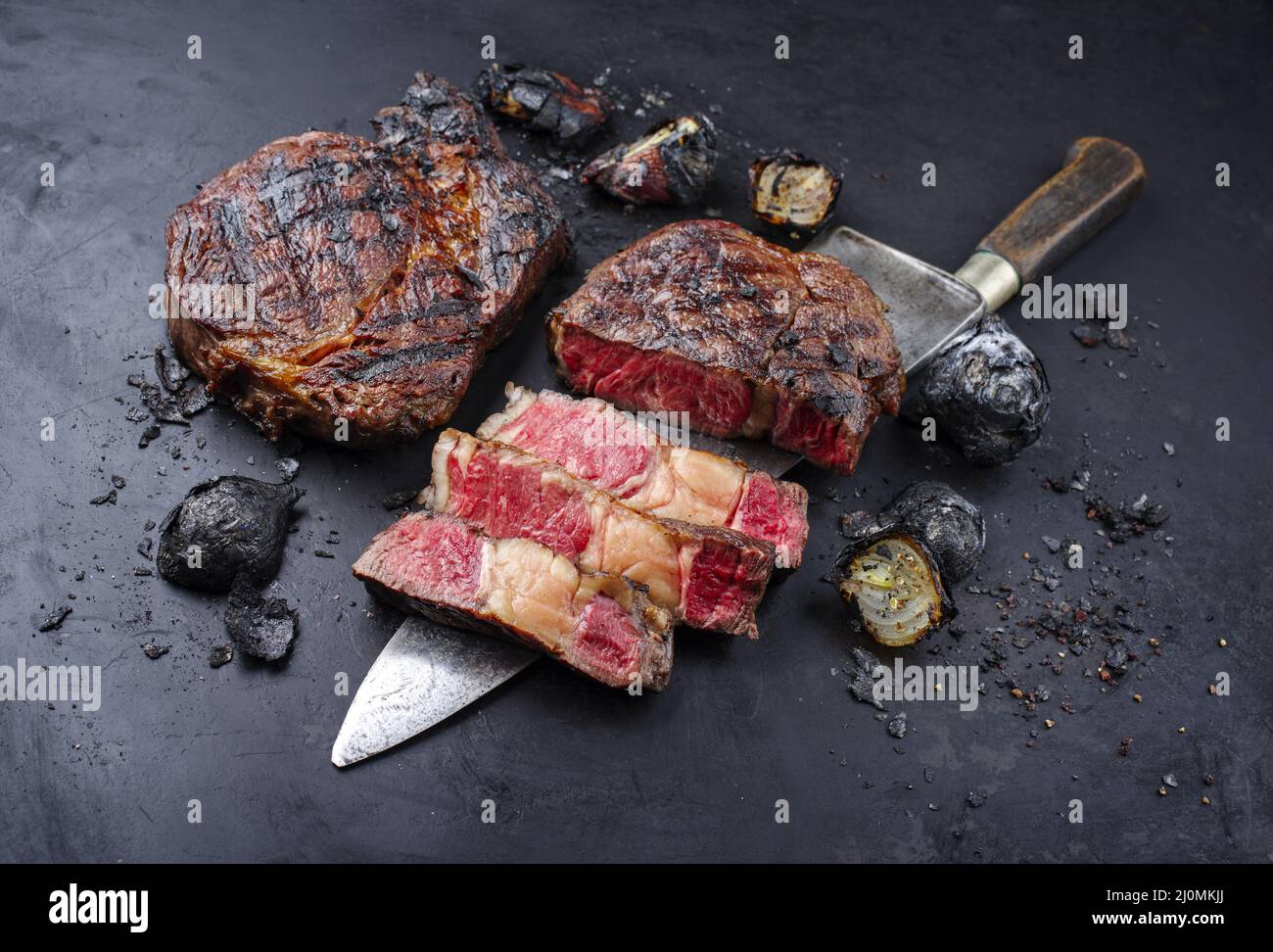 Traditional barbecue dry aged wagyu rib-eye beef steaks with charred ...