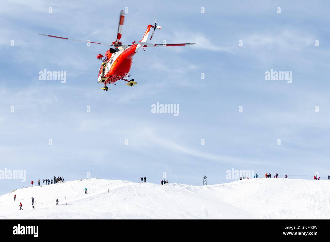 Tatra Mountains. Red and white rescue helicopter, flying over Kasprowy ...