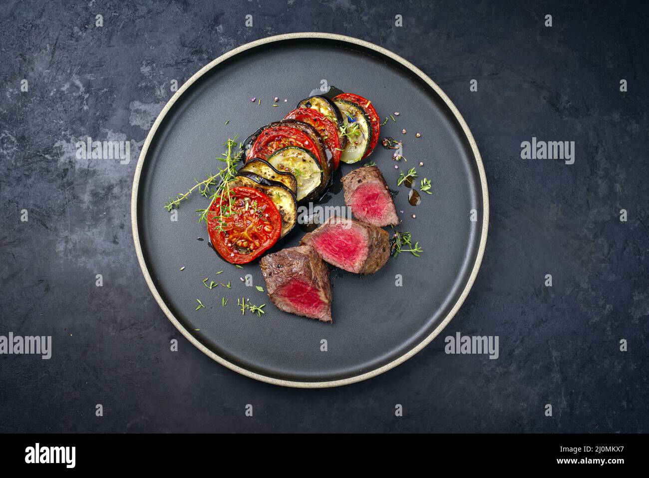 Modern style fried angus beef filet steak with traditional French ...