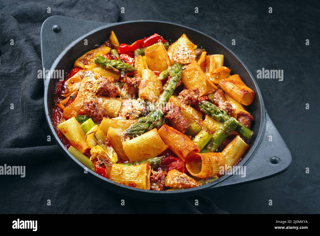 Traditional roasted Italian pasta mezzi paccheri rigati con salsiccia ...