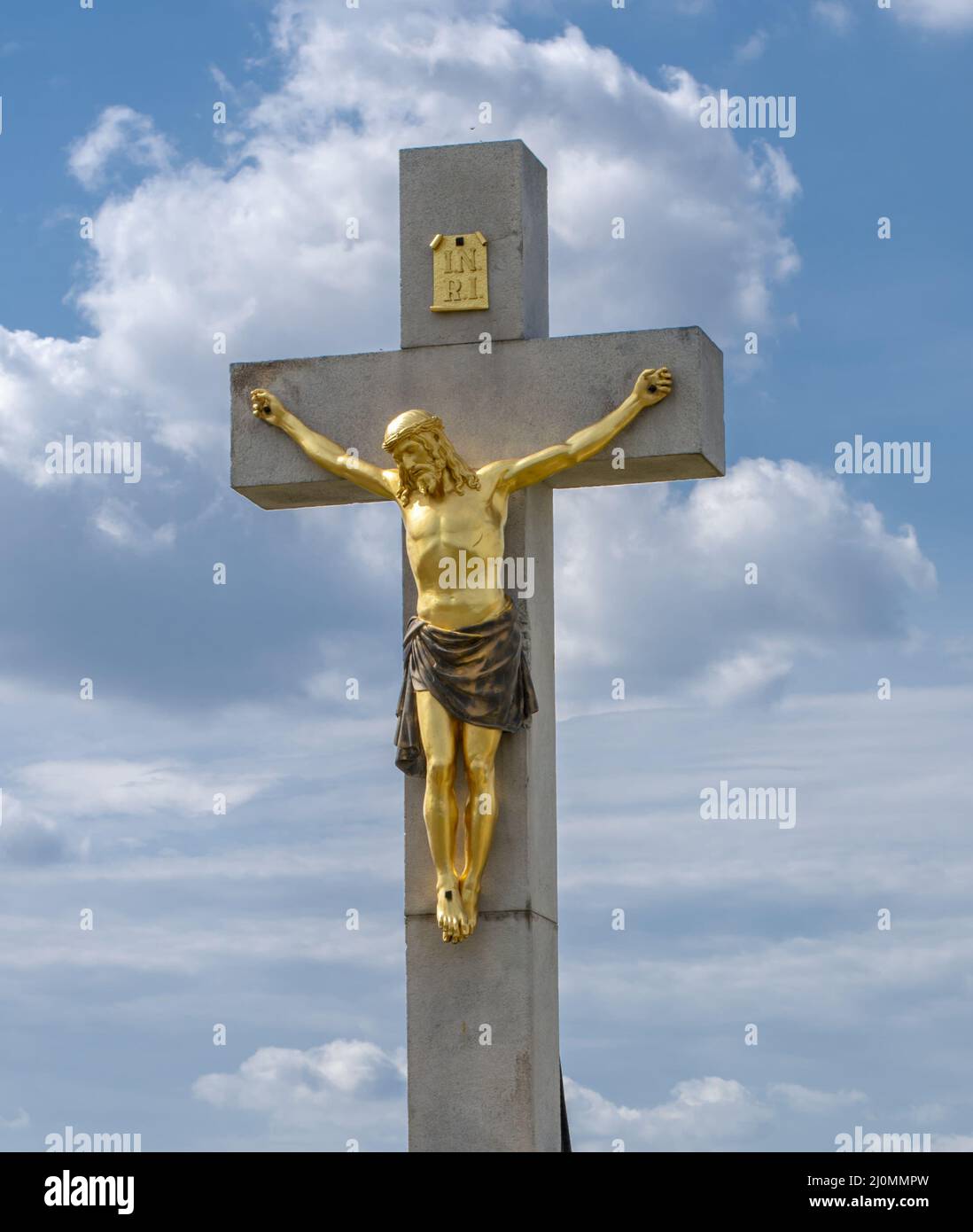 Golden crucified Jesus Christ on the cross. Close up. Detail. Nitra ...