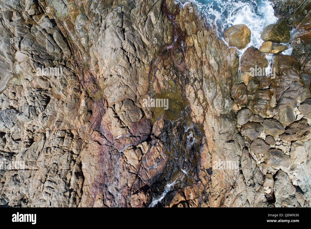 Aerial view top down of seashore waves and Rocky coast view Stones ...