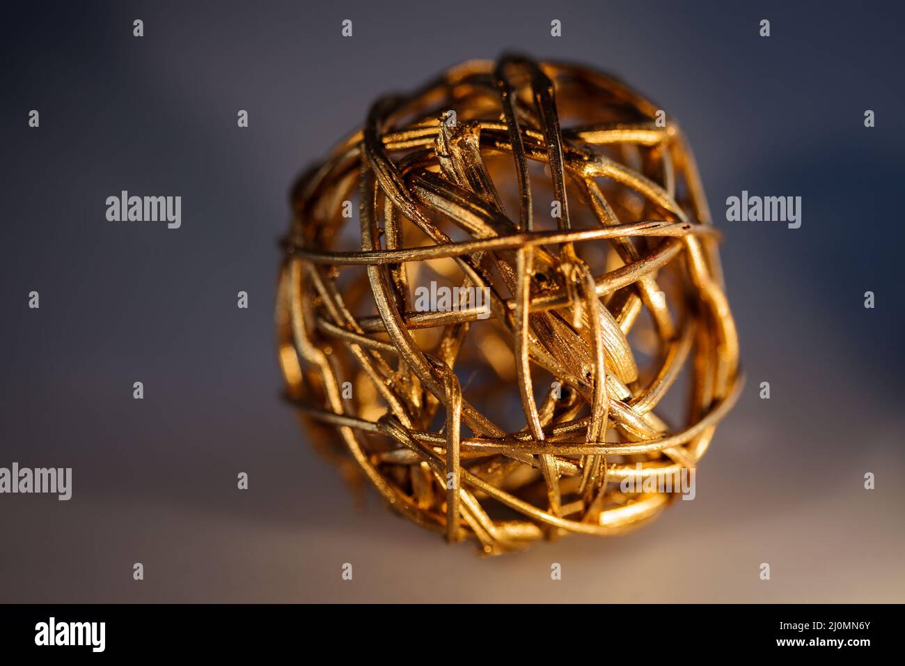Sphere of pliable twigs painted gold to form a decorative object Stock ...