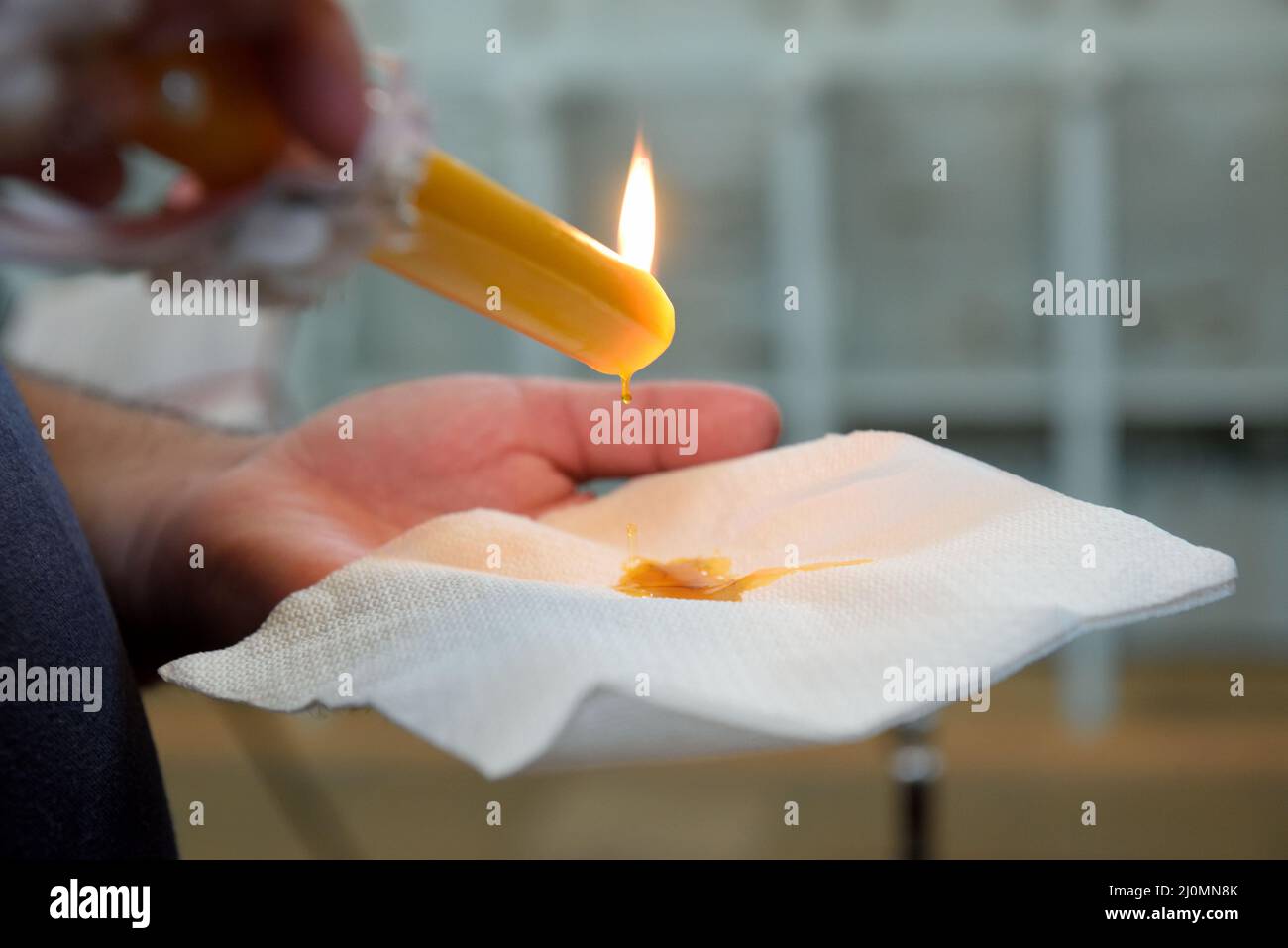 Dripping wax on hand hi-res stock photography and images - Alamy