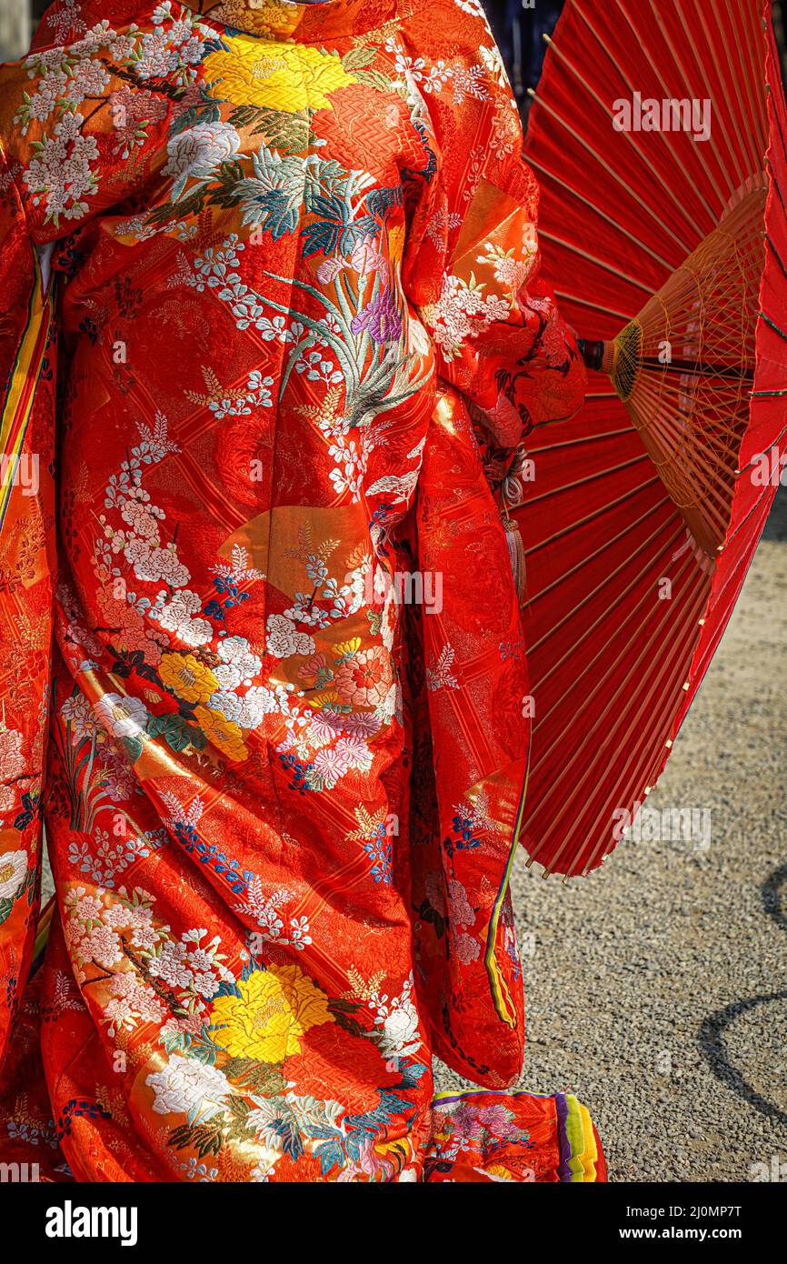 Red twelve-layered ceremonial kimono (Japanese national costume Stock ...