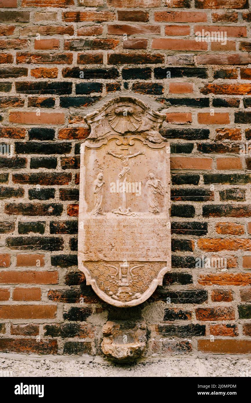 Tombstone with inscriptions on the church. Munich, Germany Stock Photo ...