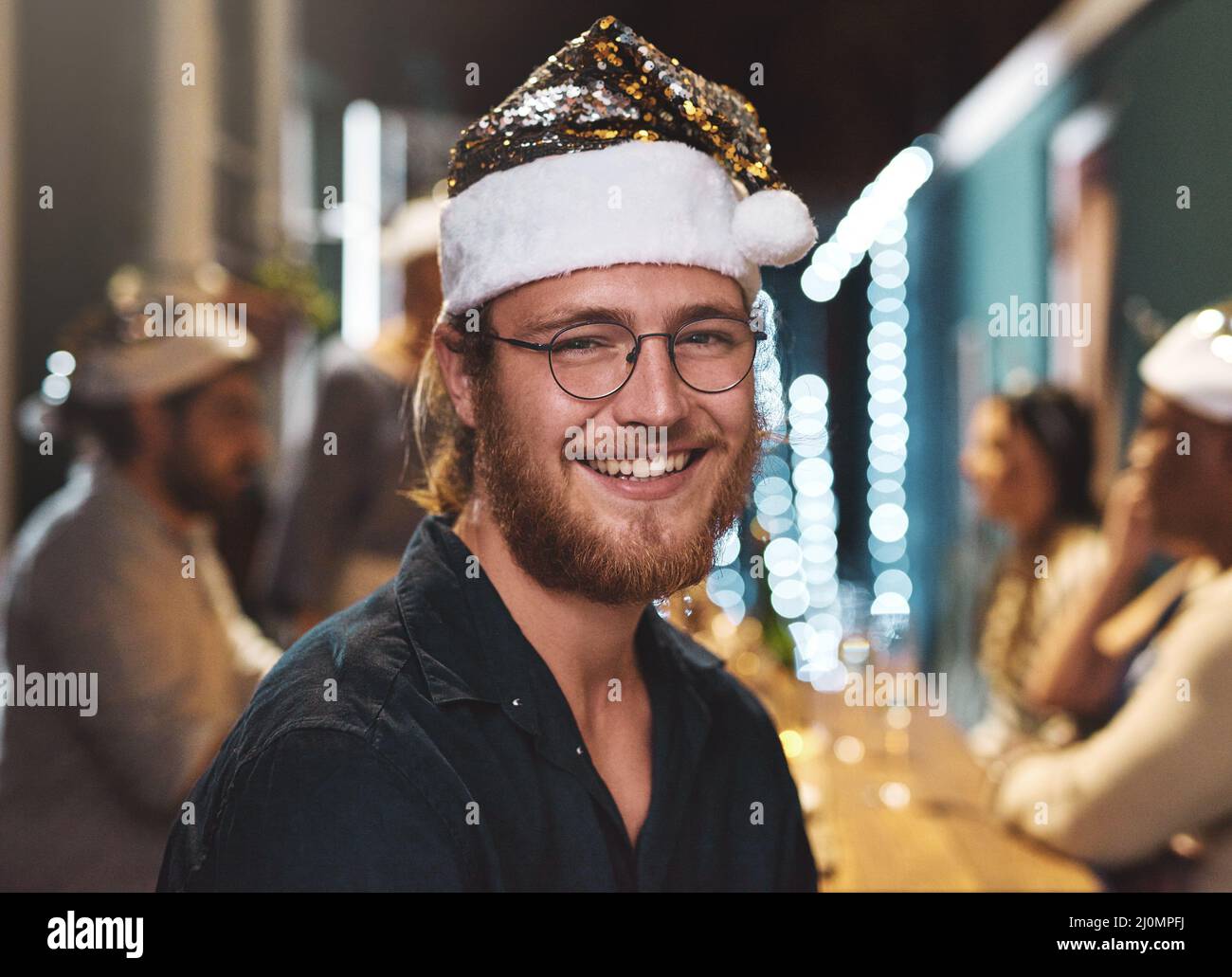Im the young Santa Claus. Portrait of a cheerful young man wearing a ...
