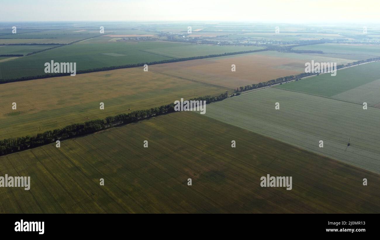 Aerial drone view flight over different agricultural fields Stock Photo ...