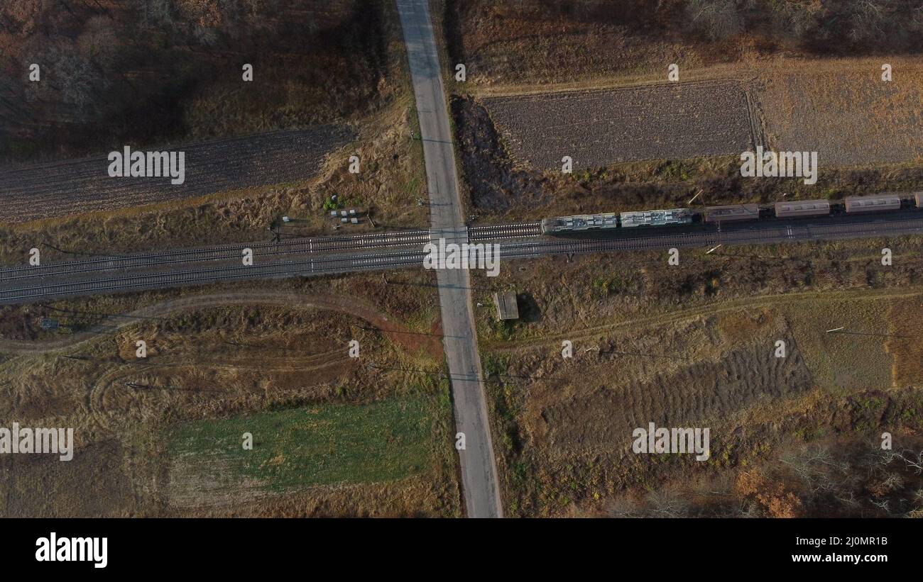 Top View Freight Train Passing Railway Crossing. Aerial Drone View ...