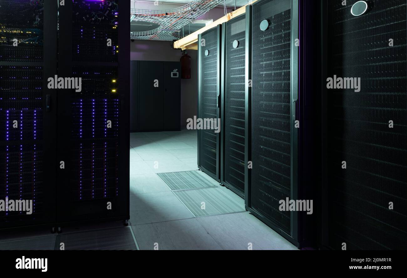 Data center with multiple rows of fully operational server racks Stock Photo - Alamy