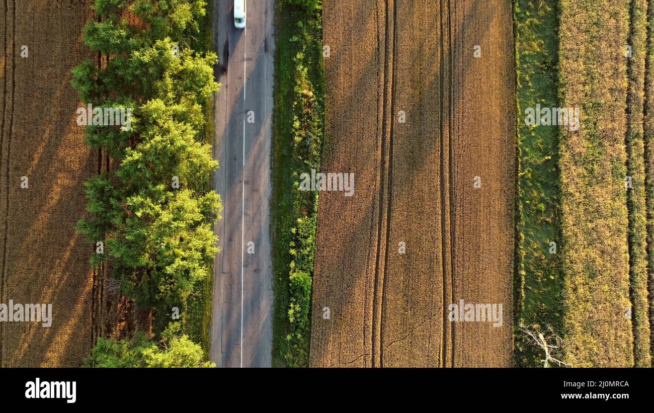 Aerial drone view flight over asphalt road with green trees Stock Photo ...