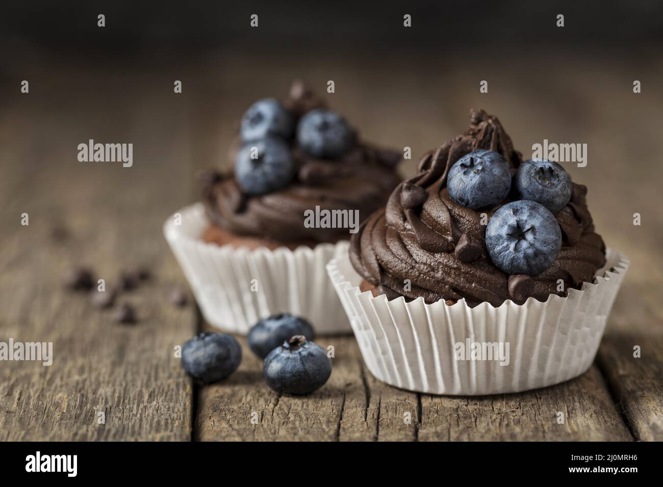 Front view view tasty cupcake blurred background Stock Photo - Alamy